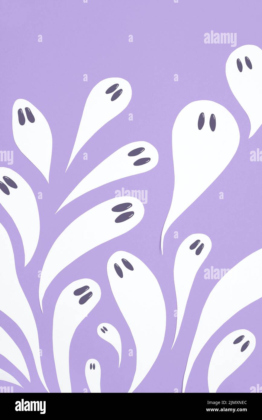 Halloween design, group of cute white ghosts flying on lilac background ...