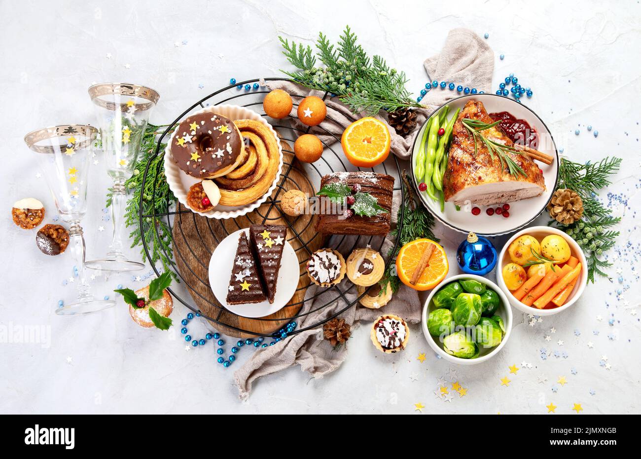 Delicious Christmas themed dinner table with roasted meat, potato ...