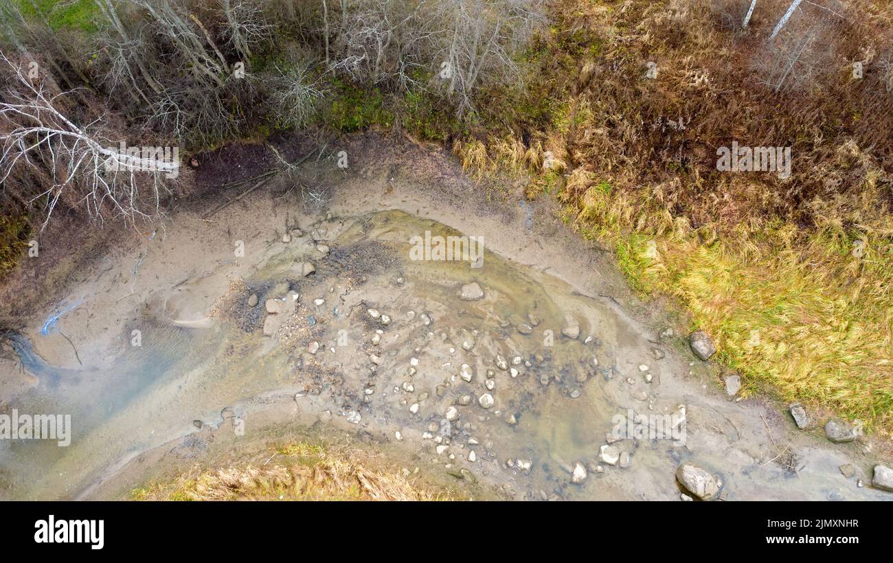 Aerial view of curving the shallow river bank. View from air. Turns of ...