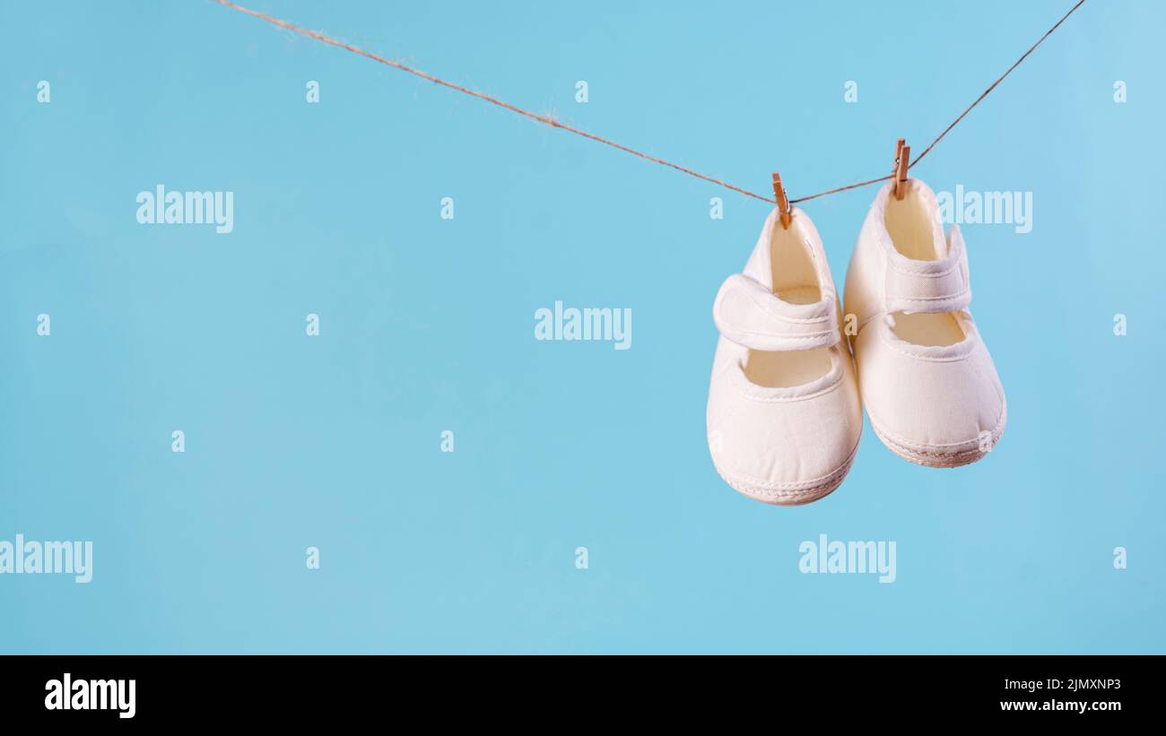 Front view cute little baby shoes with copy space Stock Photo - Alamy