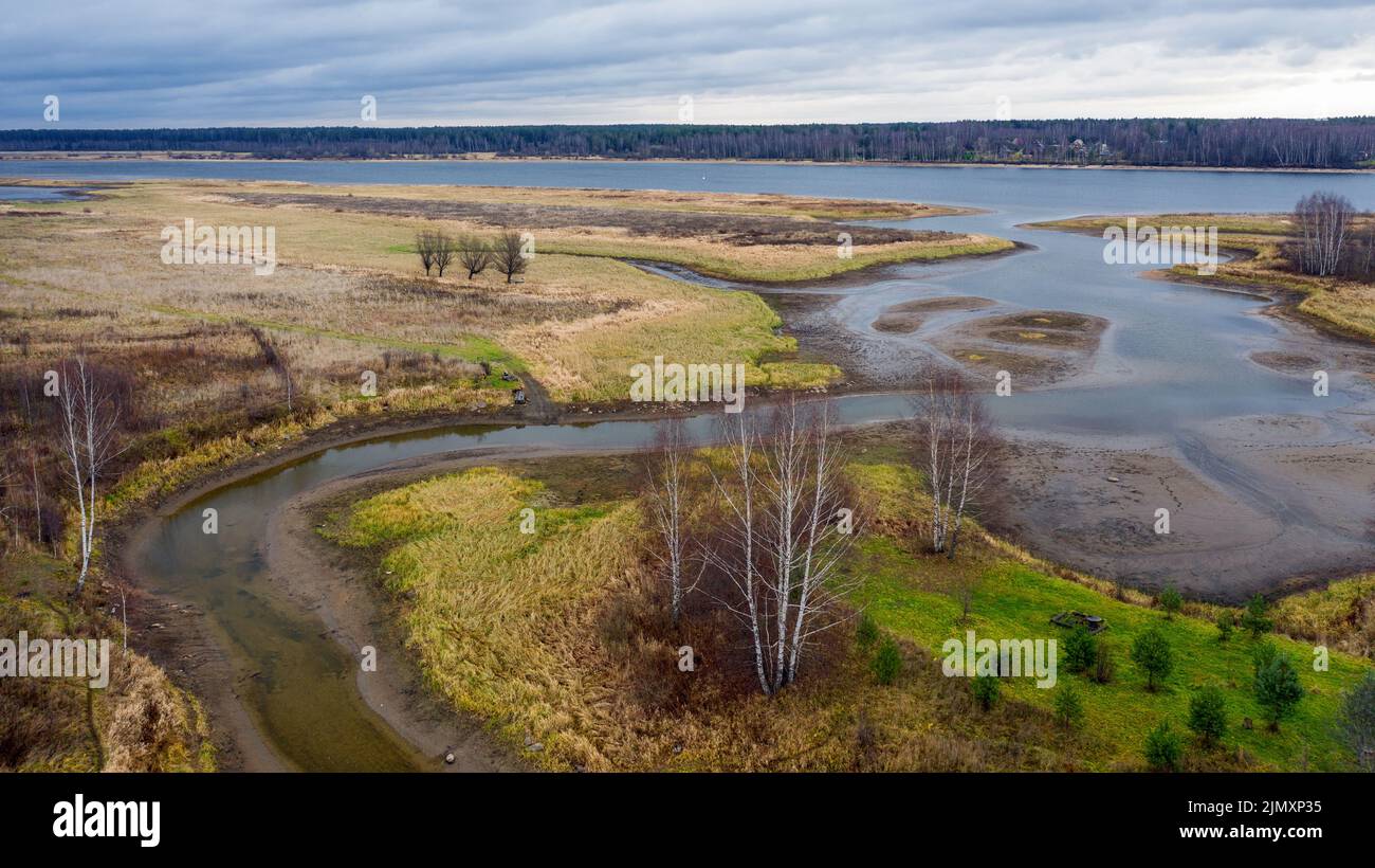 Aerial view of beautiful curving river at sunrise in autumn. View from ...