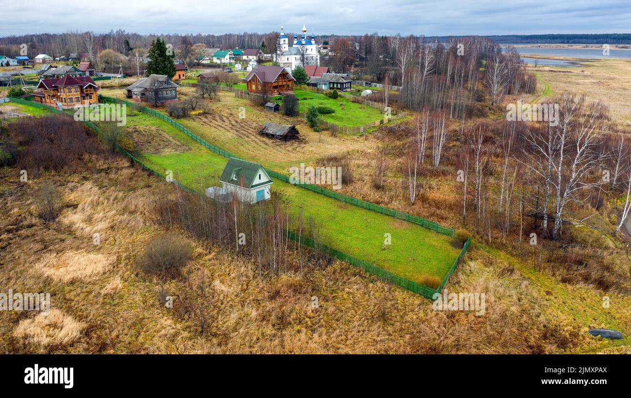 Aerial view of the village on a high hill above the river at sunrise in ...