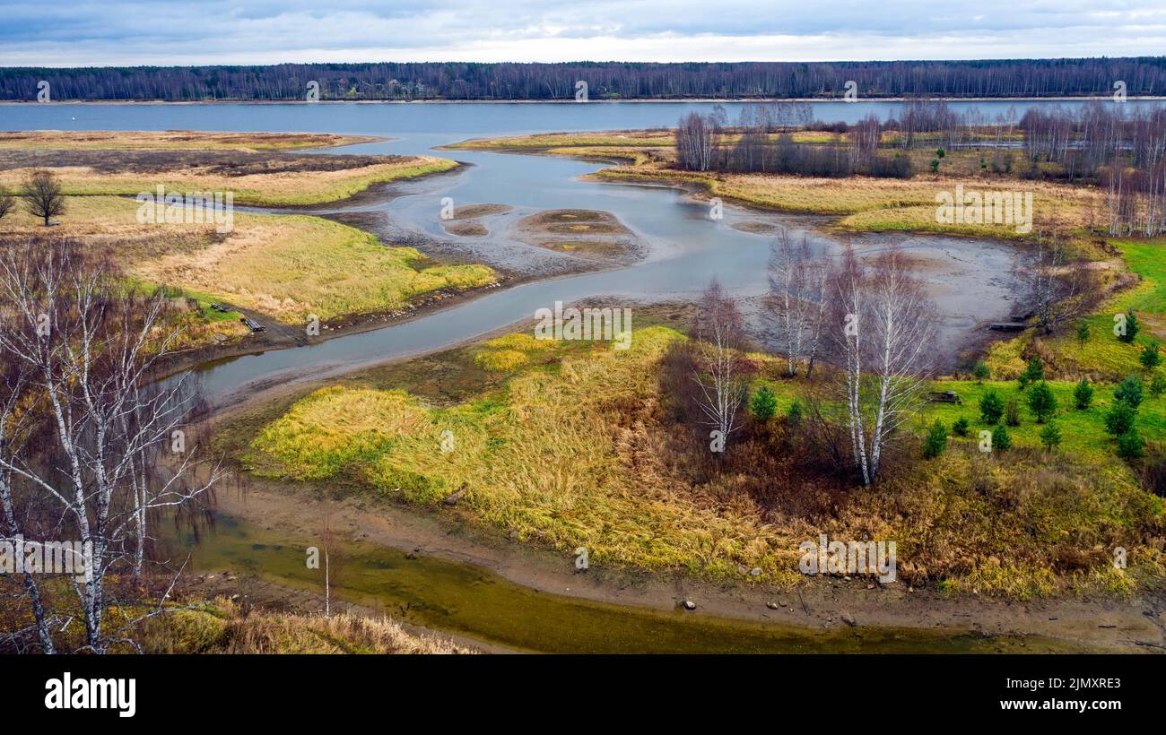 Aerial view of beautiful curving river at sunrise in autumn. View from ...