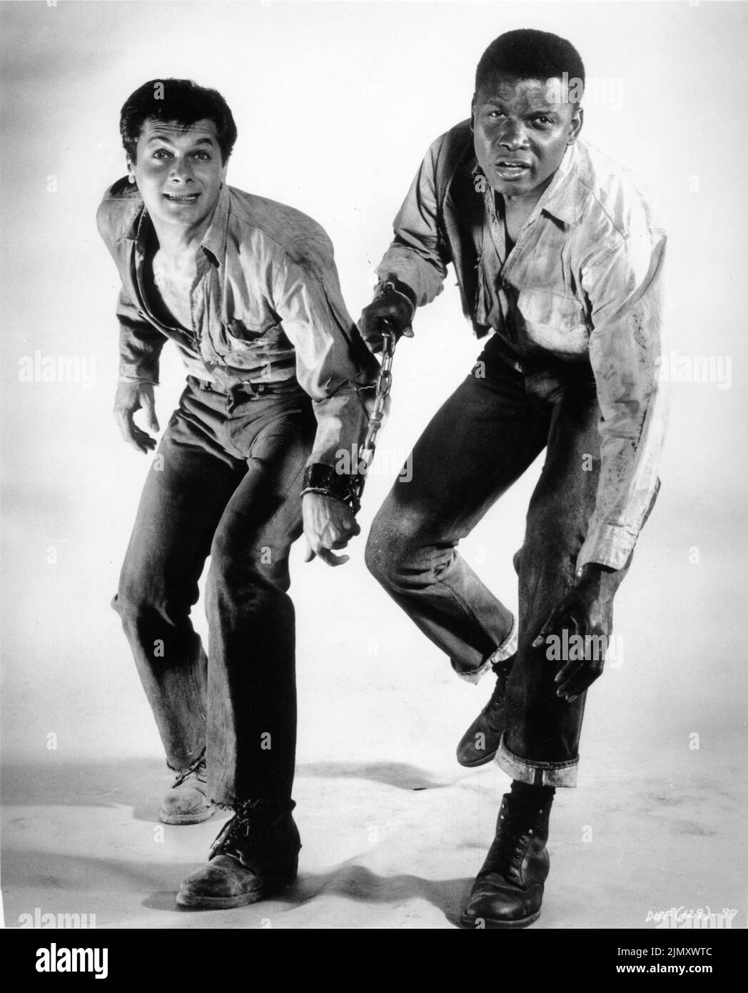 TONY CURTIS and SIDNEY POITIER posed publicity portrait in THE DEFIANT ...