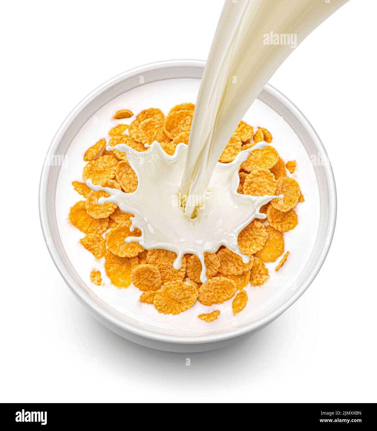 Corn flakes with pouring milk isolated on white background, top view ...