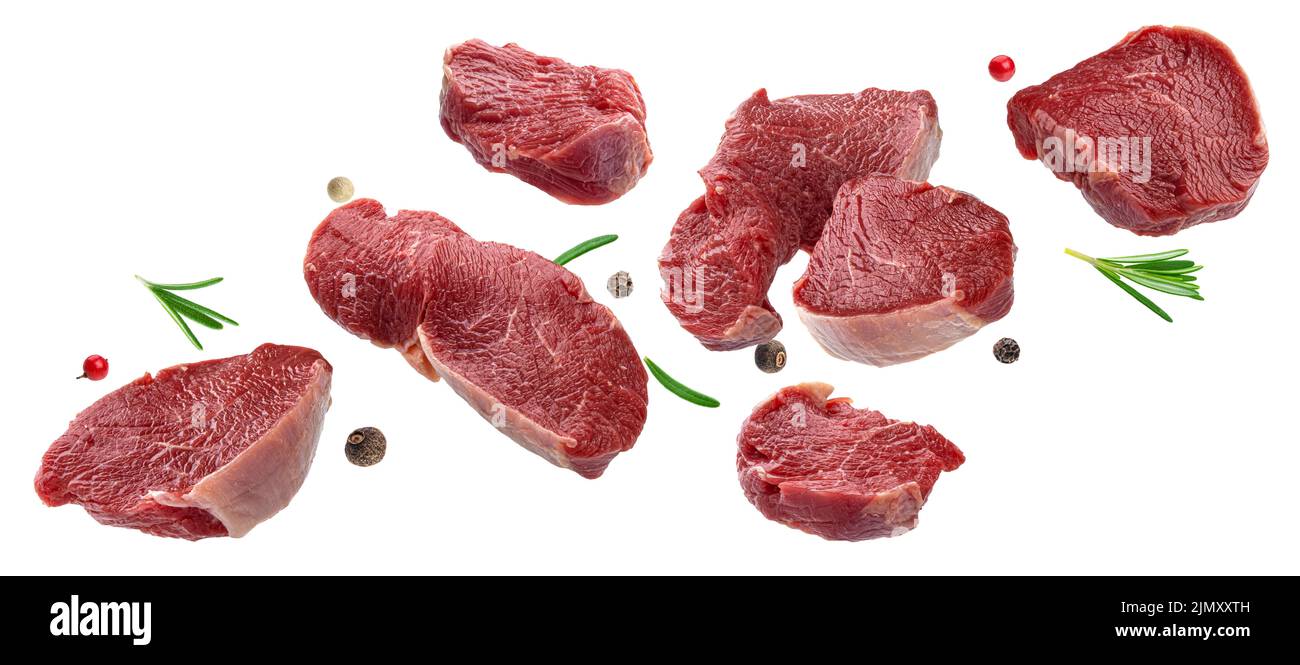 Falling raw beef meat isolated on white background Stock Photo - Alamy