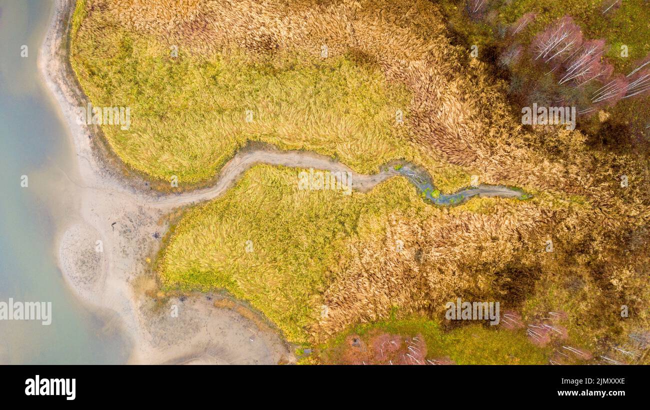Aerial view of beautiful curving the river bank and the stream flowing ...