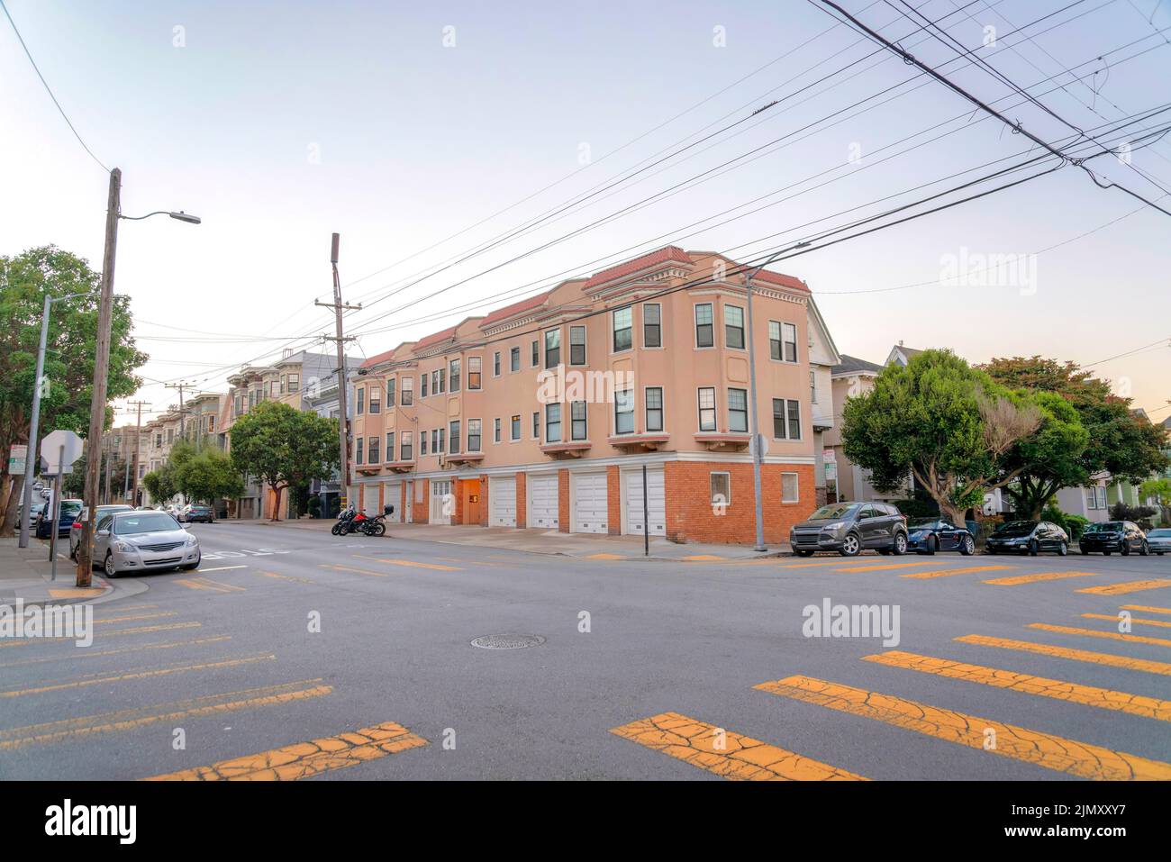 Intersection road in San Francisco, CA with apartment building at the ...