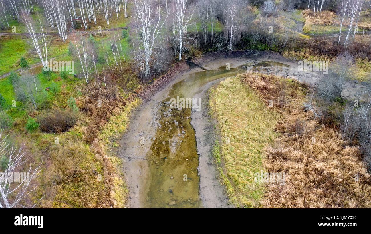 Aerial view of curving the shallow river bank. View from air. Turns of ...