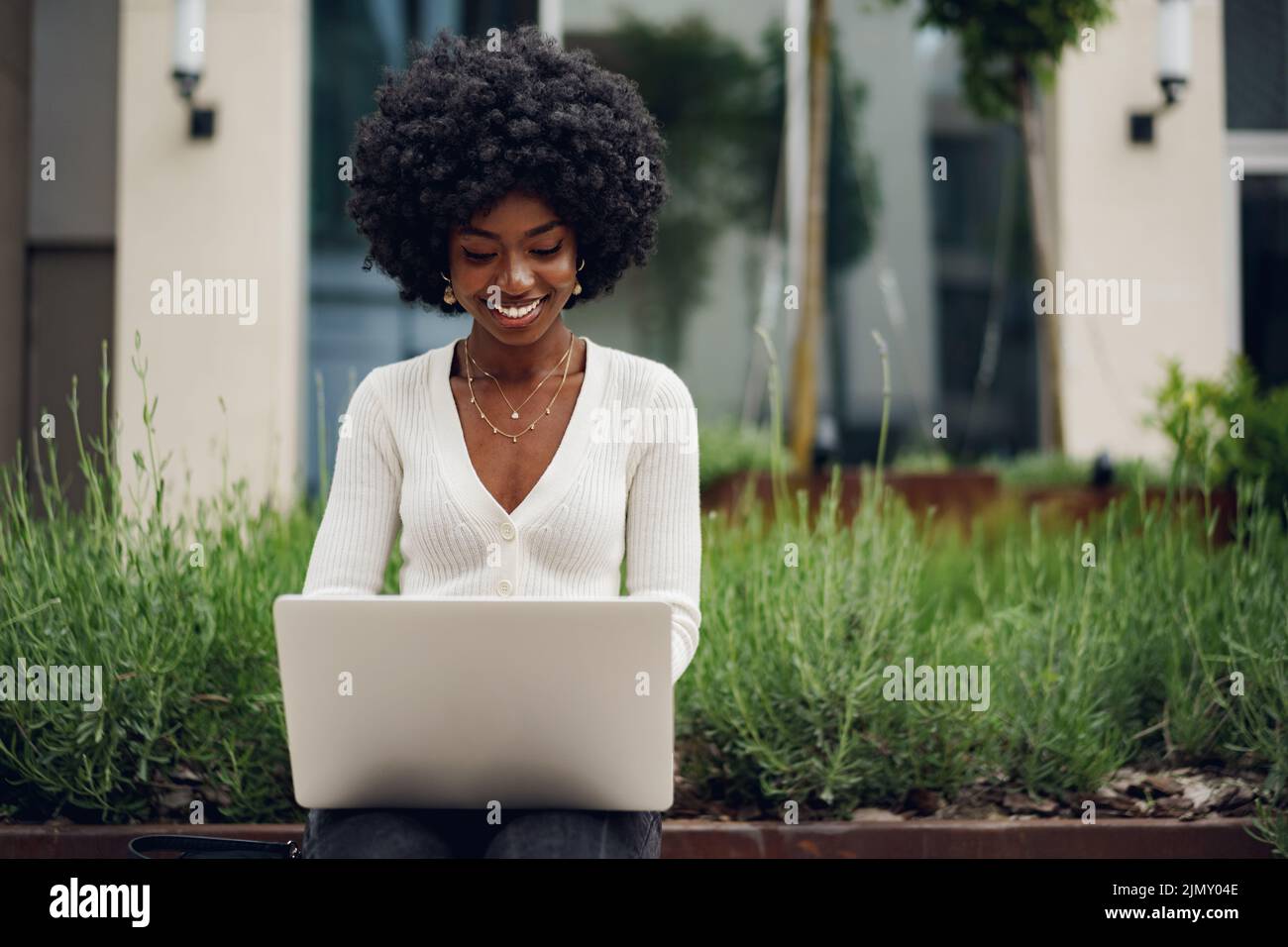 Young african american businesswoman working using laptop sitting on ...