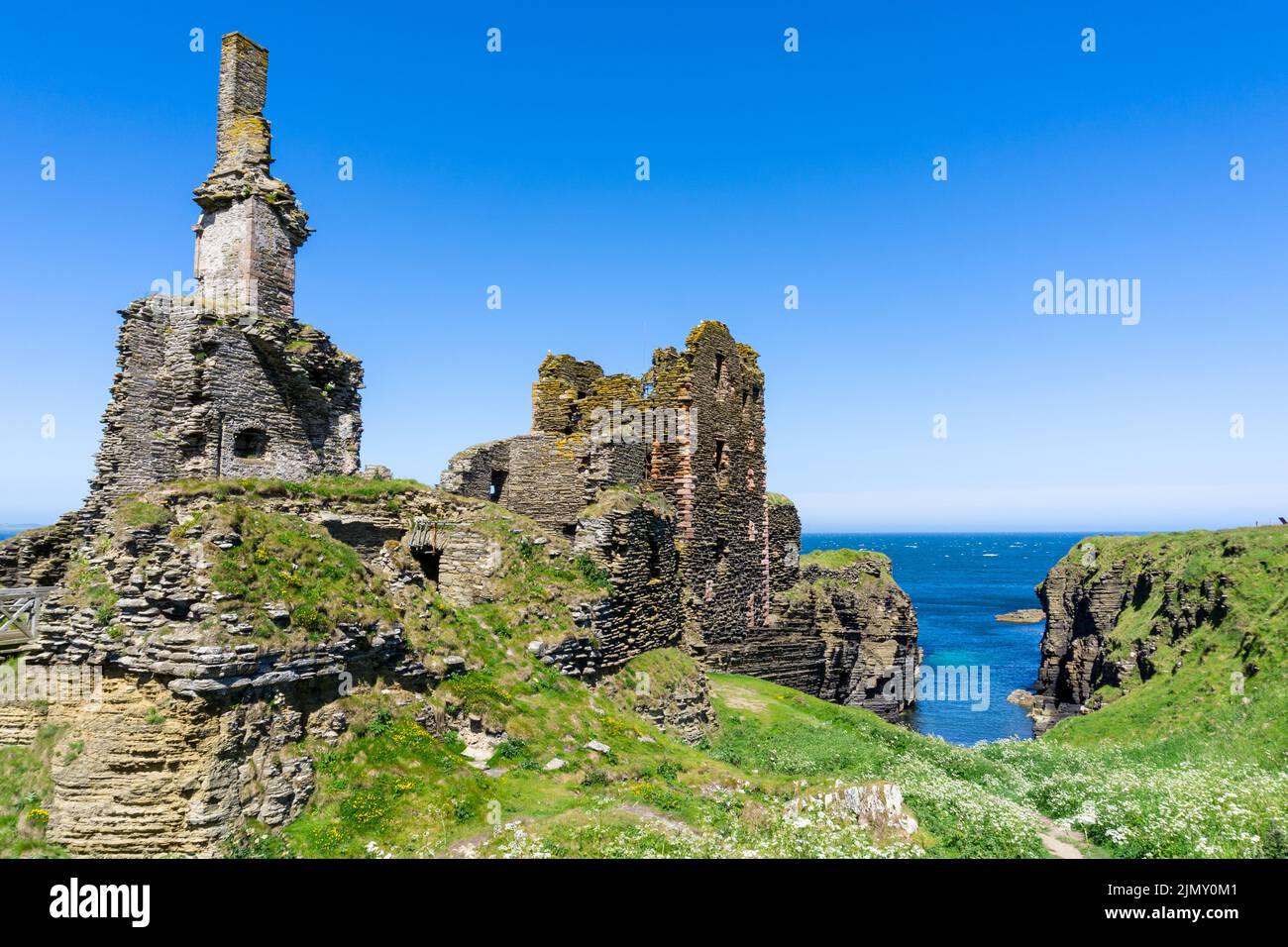 View of the Caithness coast and the ruins of the historic Castle ...