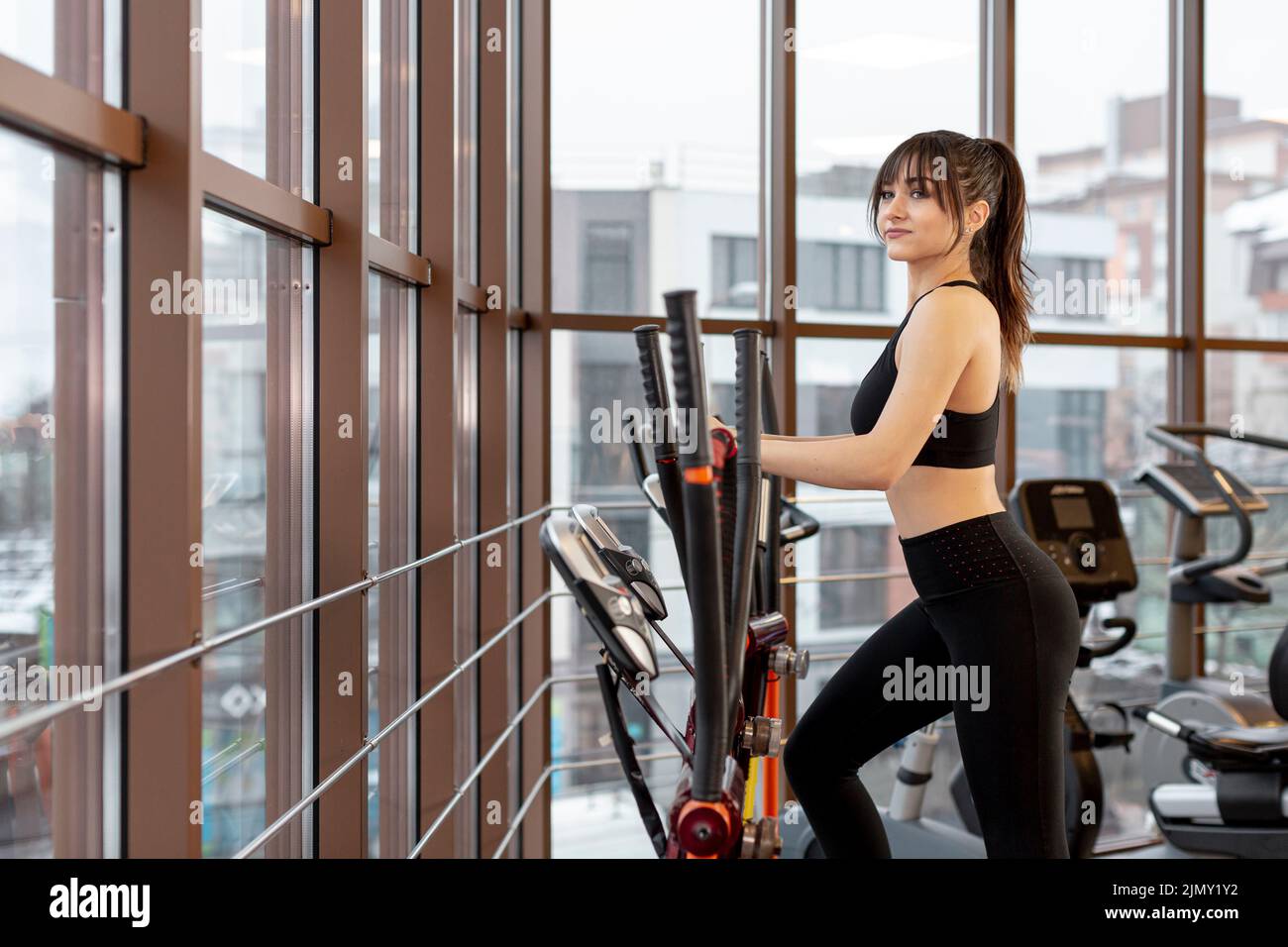 Side view woman working treadmill Stock Photo - Alamy