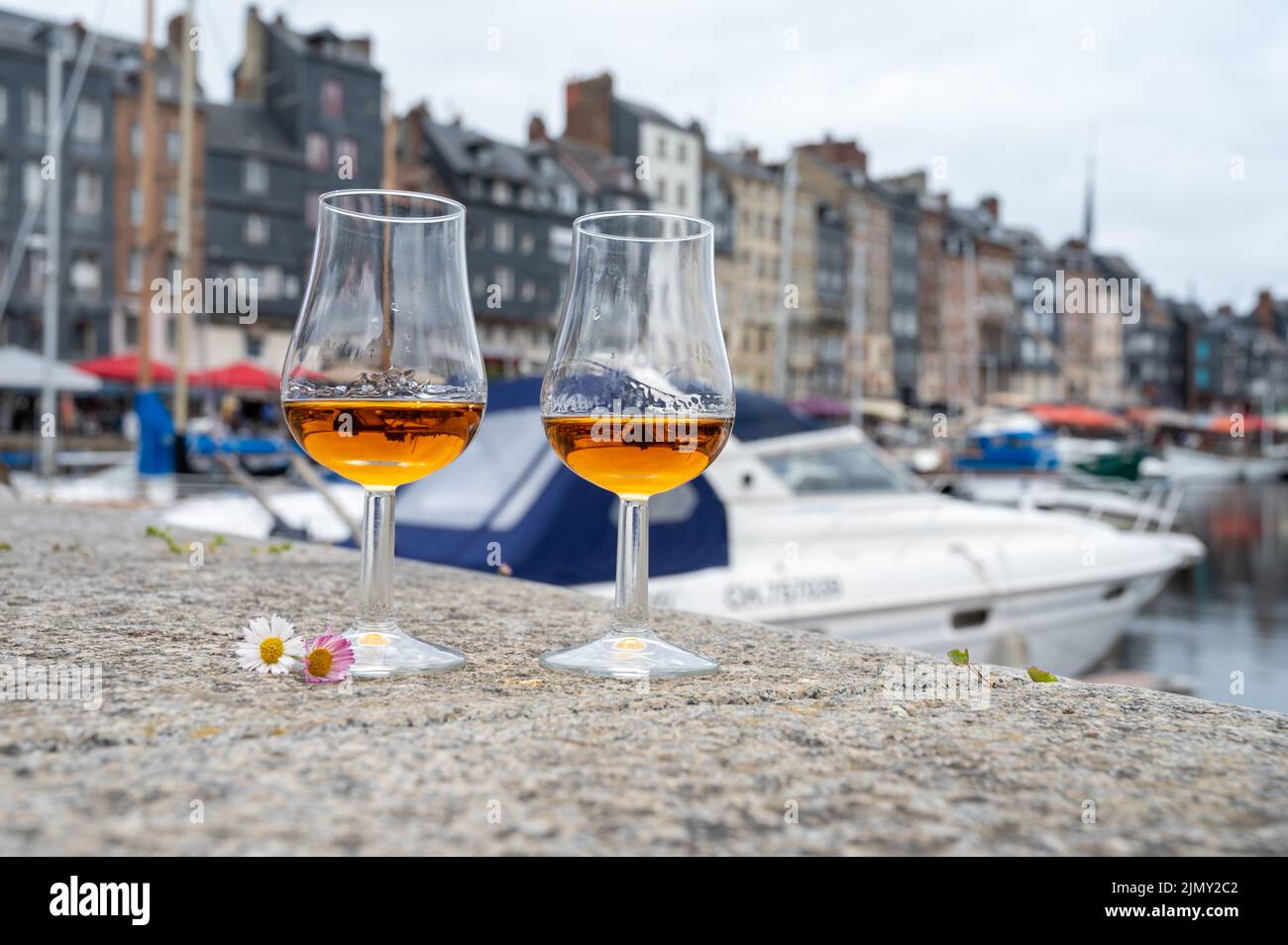 Tasting of apple calvados drink from glasses in old Honfleur harbour ...