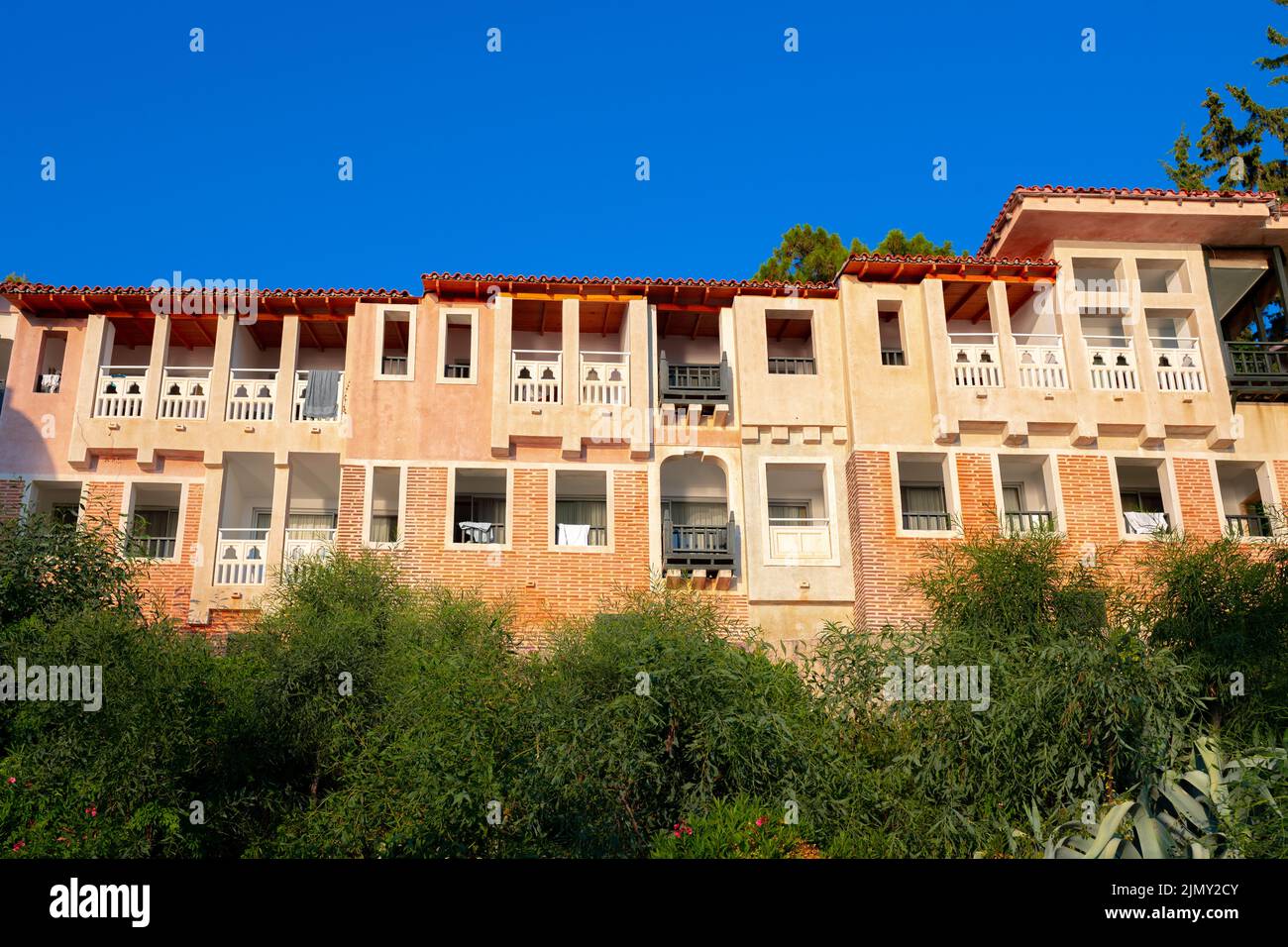 Stone facade of old residential building in greek style Stock Photo - Alamy