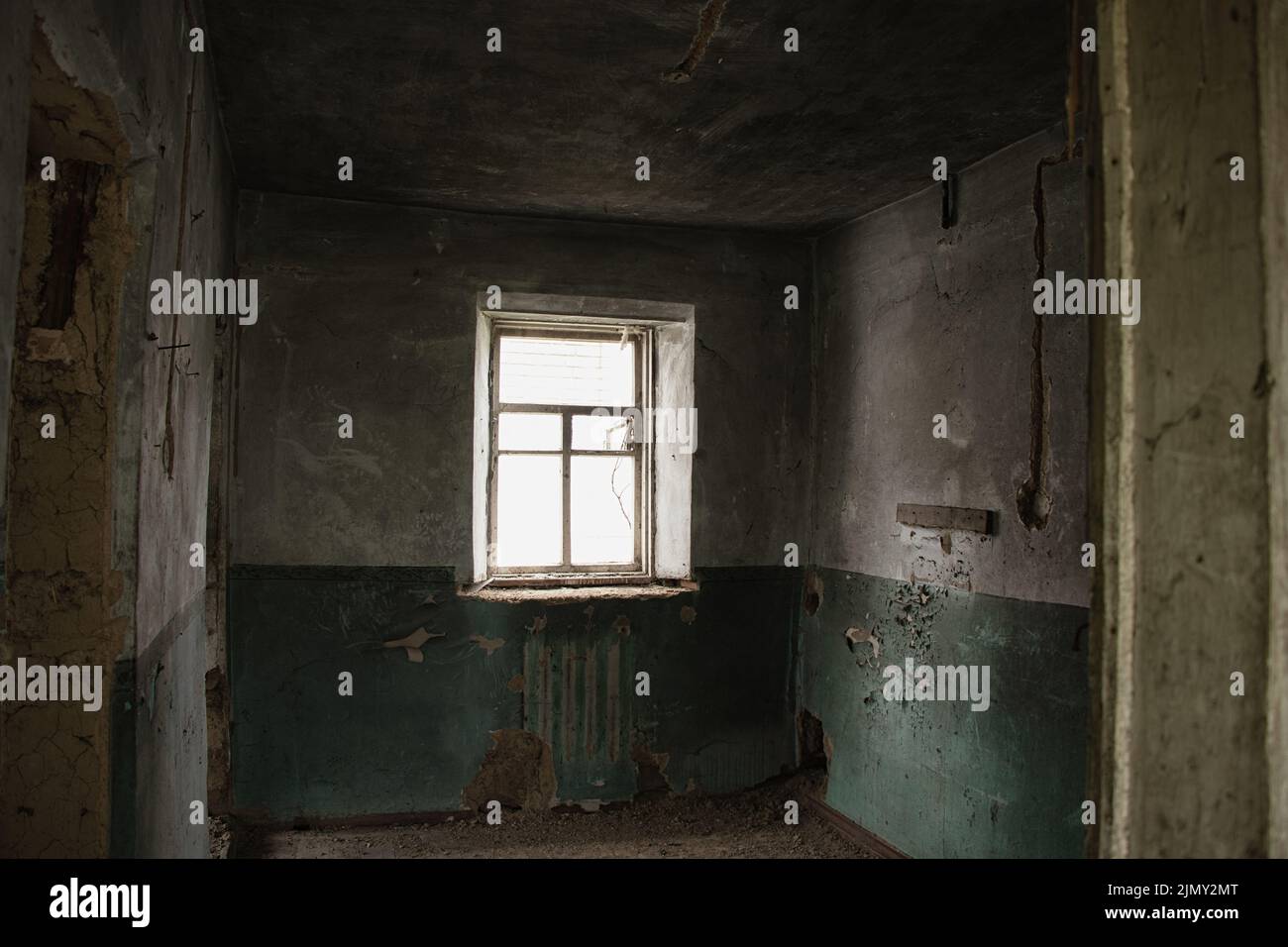 old abandoned one-story building dark without windows and doors ...