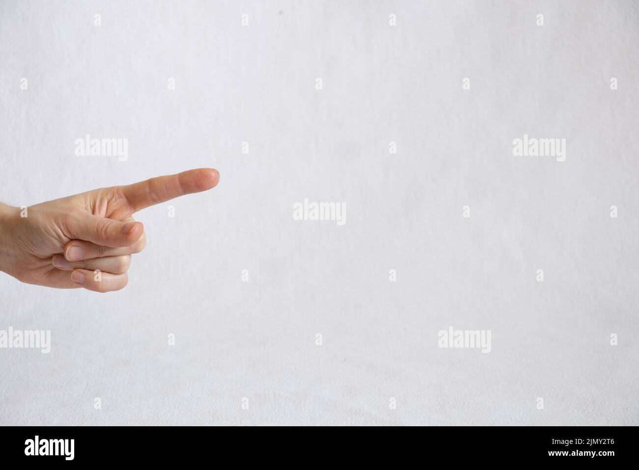 female finger on a white background, finger presses, female hand Stock ...