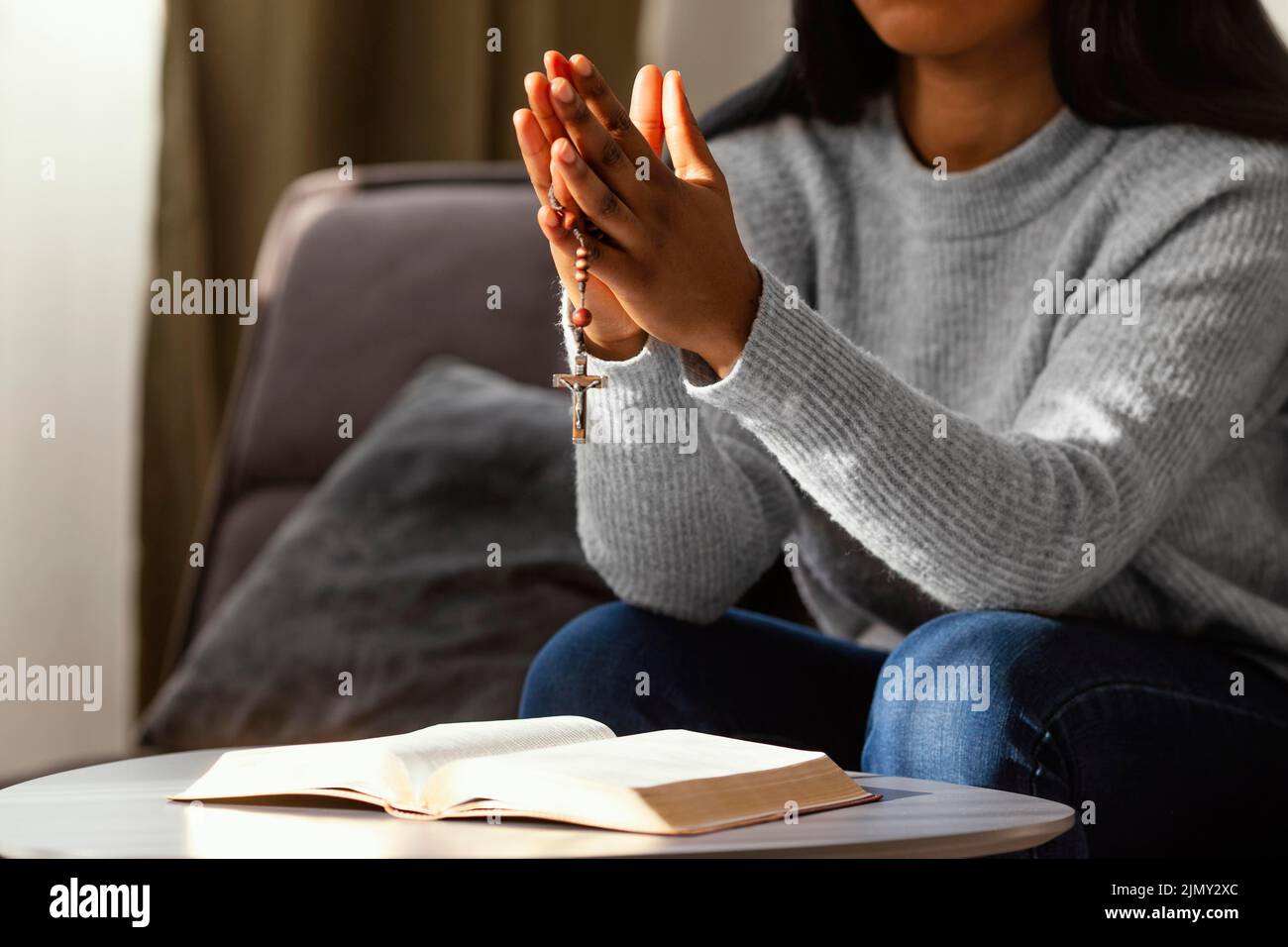 Christian woman praying jesus cross hi-res stock photography and images ...