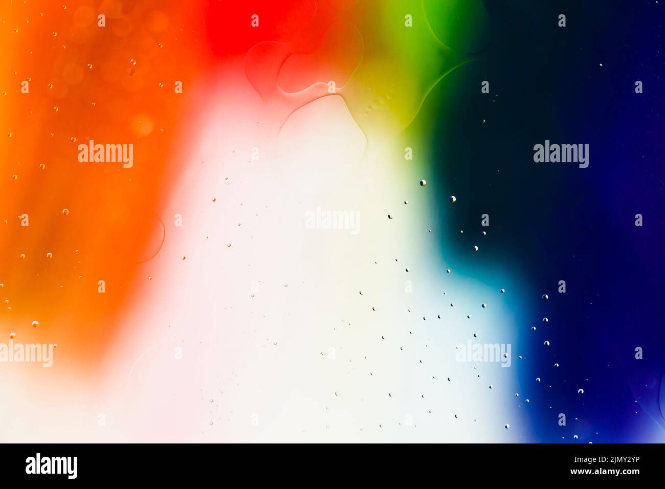 Mixing water oil coloured liquid abstract background Stock Photo - Alamy