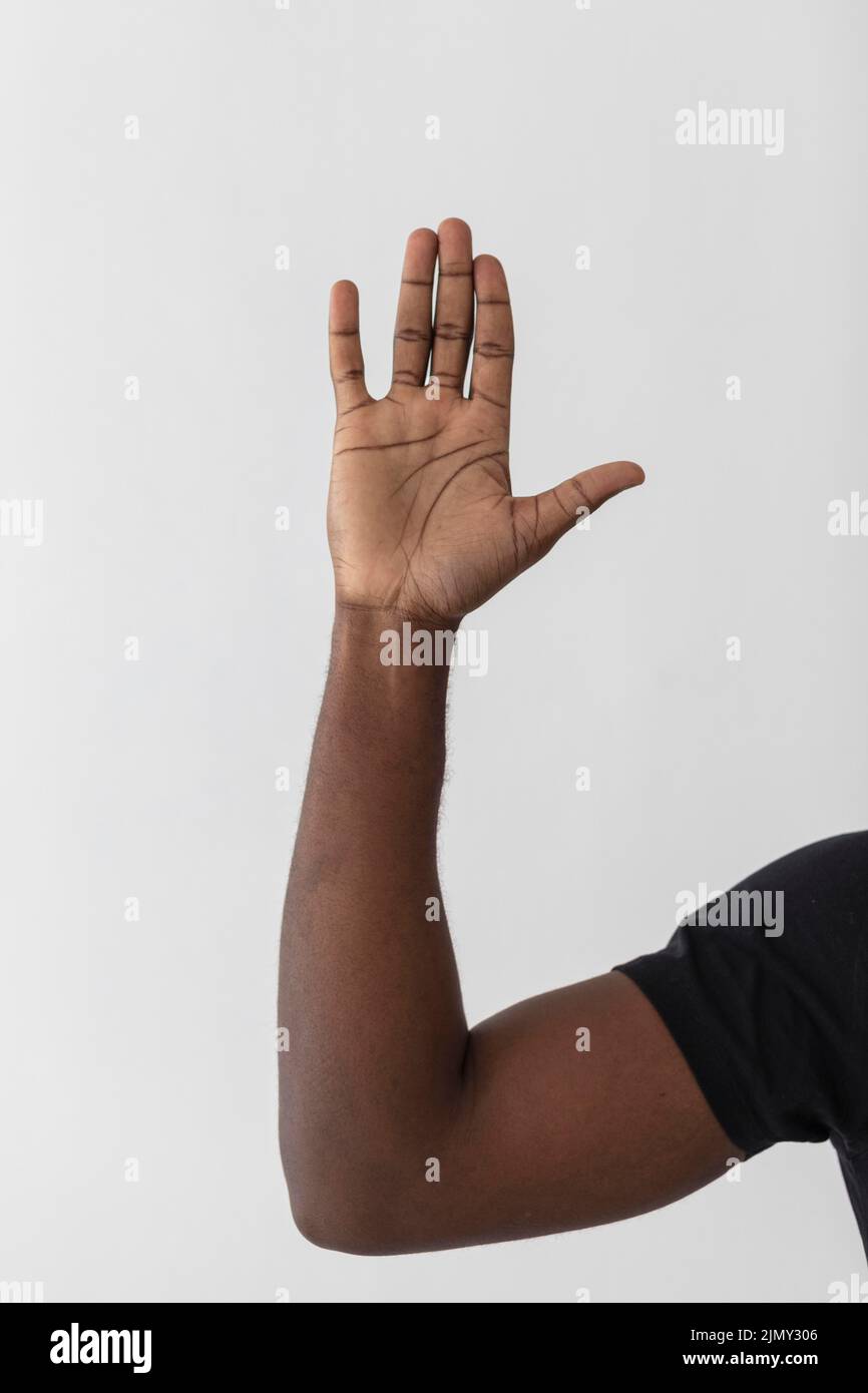 Person raising one hand air Stock Photo - Alamy