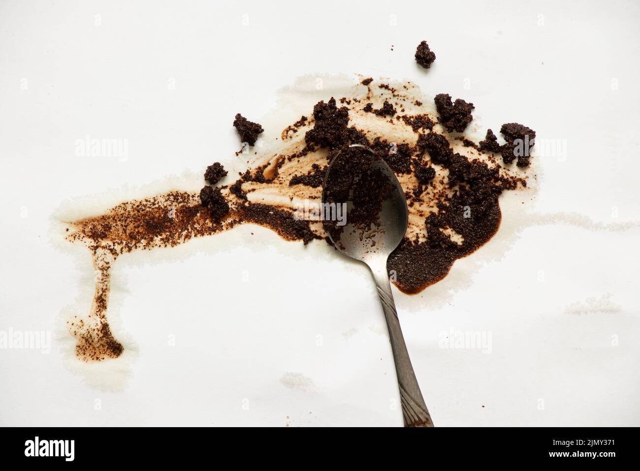 spilled coffee on white background, coffee grounds for background ...