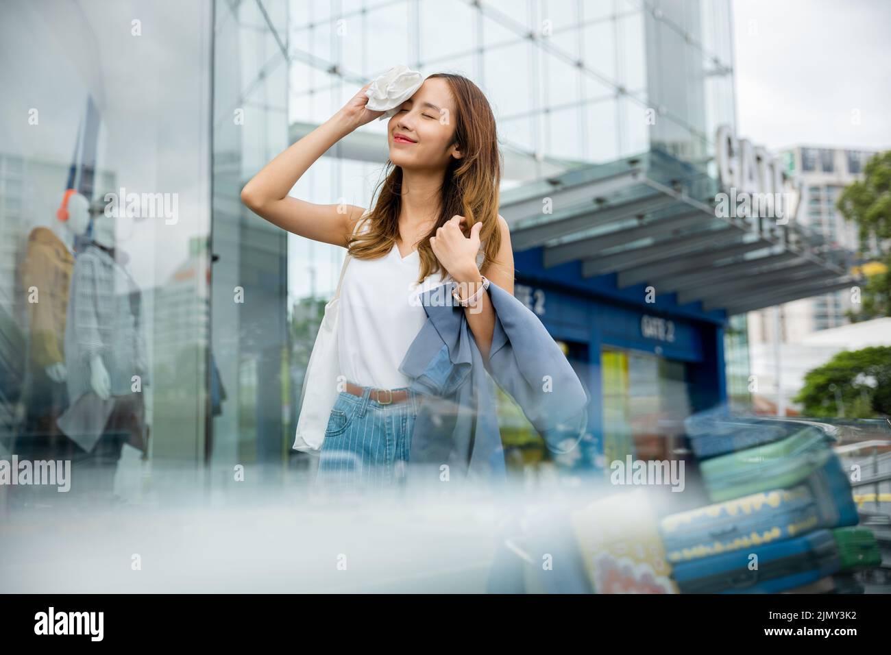 Angry female having sunstroke skin damage from sun UV city air ...