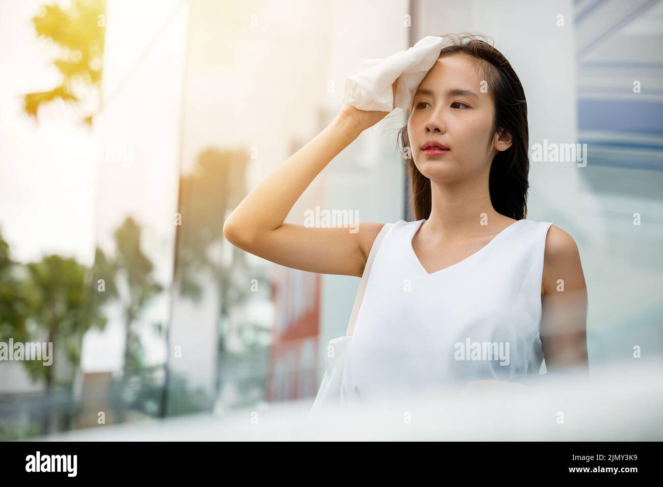 Angry female having sunstroke skin damage from sun UV city air ...