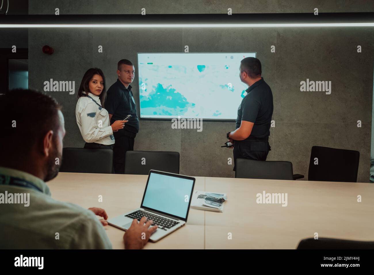 Group of Security data center operators working in a CCTV monitoring ...