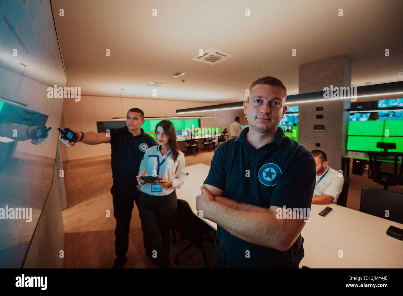 Group Of Security Data Center Operators Working In A Cctv Monitoring