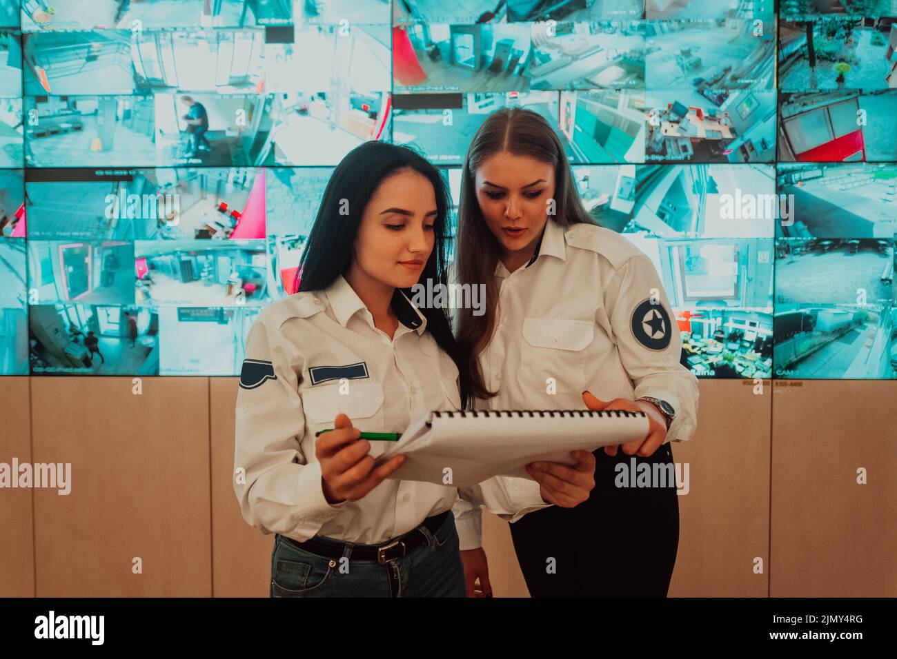 Group Of Female Security Operators Working In A Data System Control Room Technical Operators
