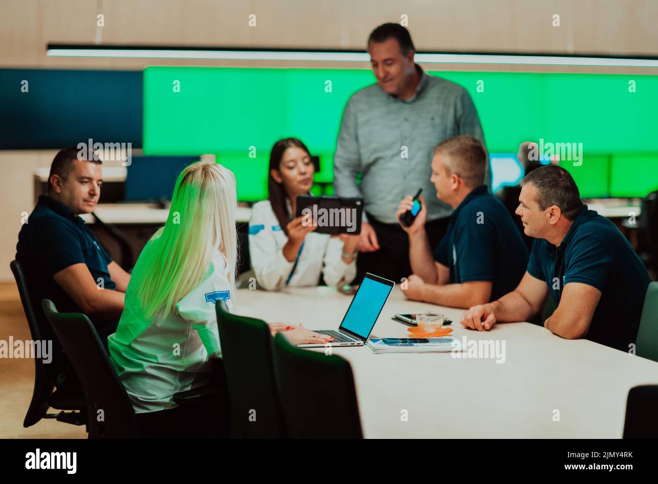 Group of security guards sitting and having briefing In the system ...