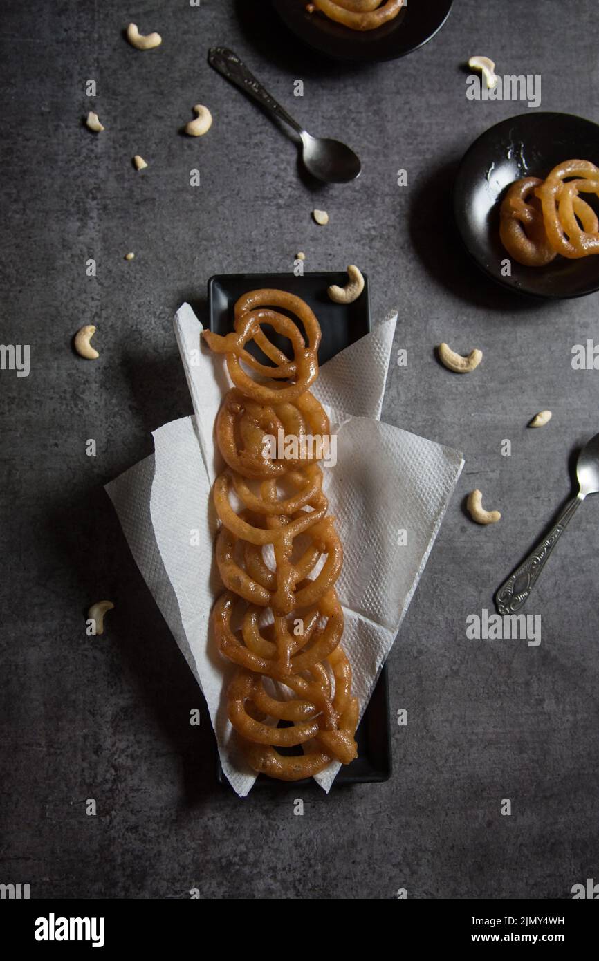 Popular Indian sweet jalebi or imarati made by deep frying in pure ghee ...