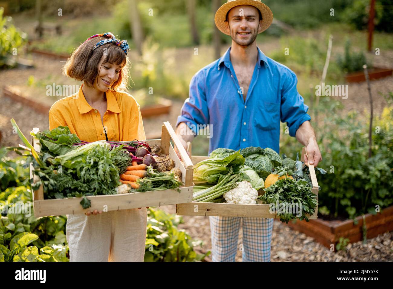 Farmers with freshly picked vegetables at garden Stock Photo - Alamy