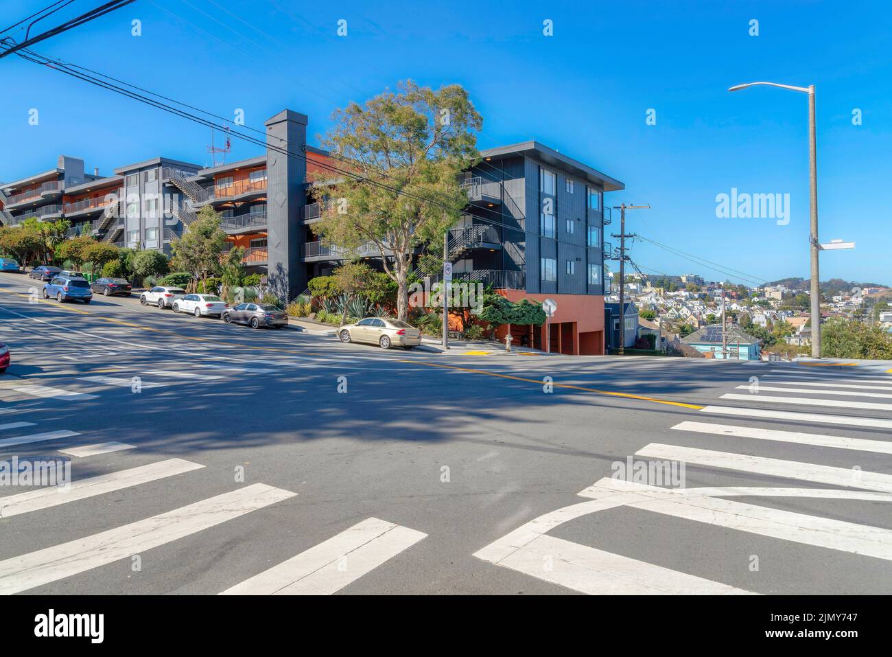 Apartment building at the corner near the intersection road with ...
