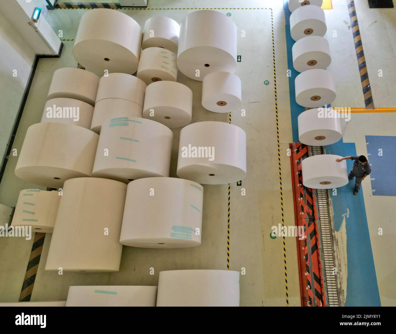 RIZHAO, CHINA - AUGUST 8, 2022 - Workers monitor the operation of a ...
