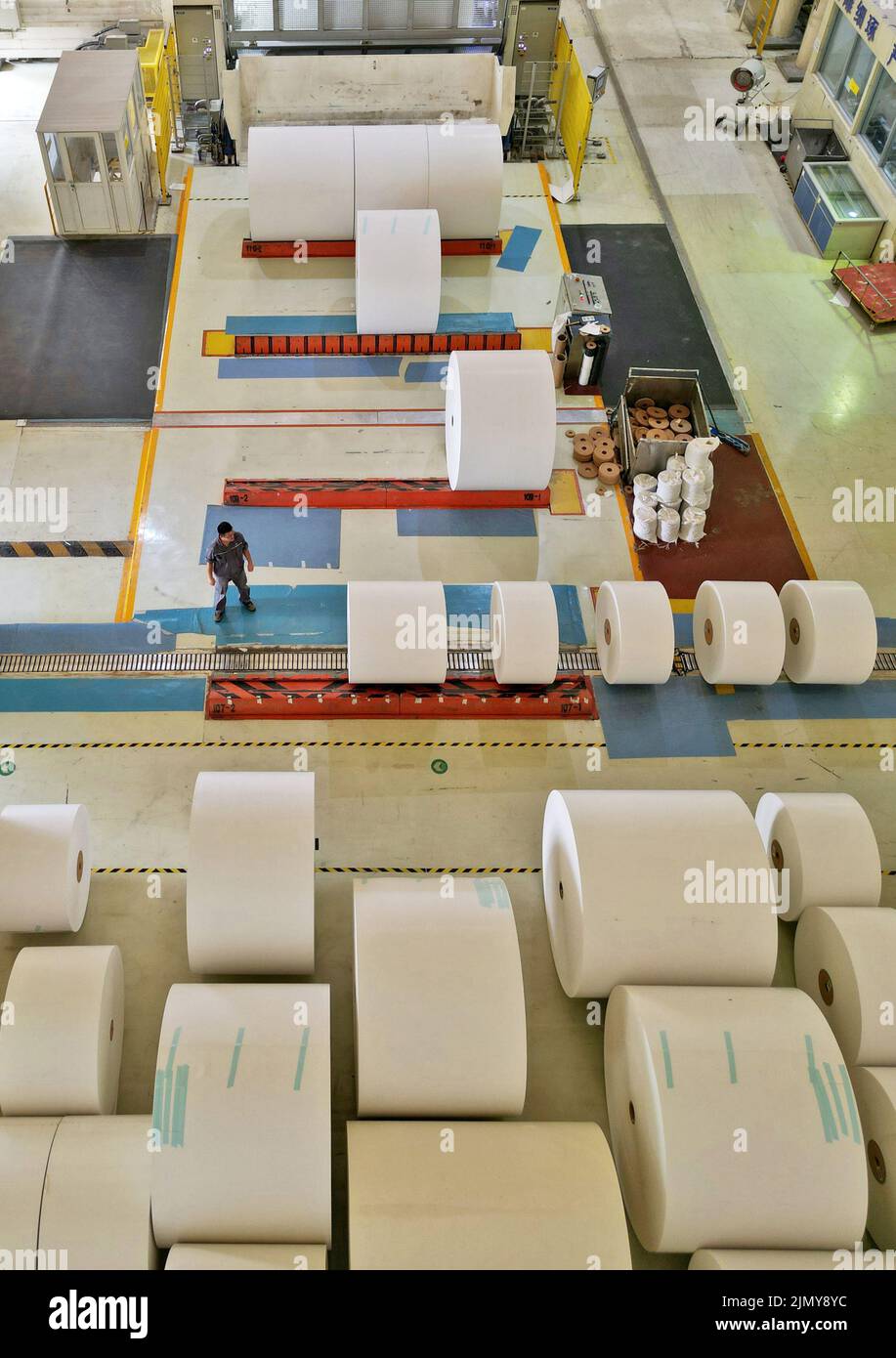 RIZHAO, CHINA - AUGUST 8, 2022 - Workers monitor the operation of a ...