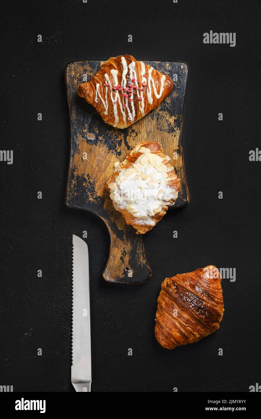 Top view of assortment of crispy croissants on serving board Stock ...