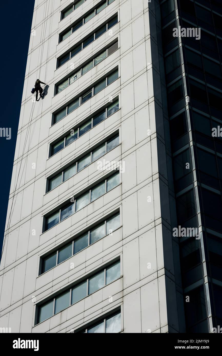 work at height. Worker hanging on climbing ropes Stock Photo - Alamy
