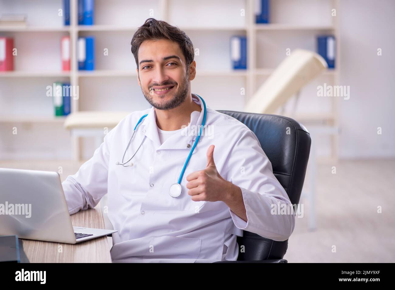 Thumbs up young doctor working hi-res stock photography and images - Alamy