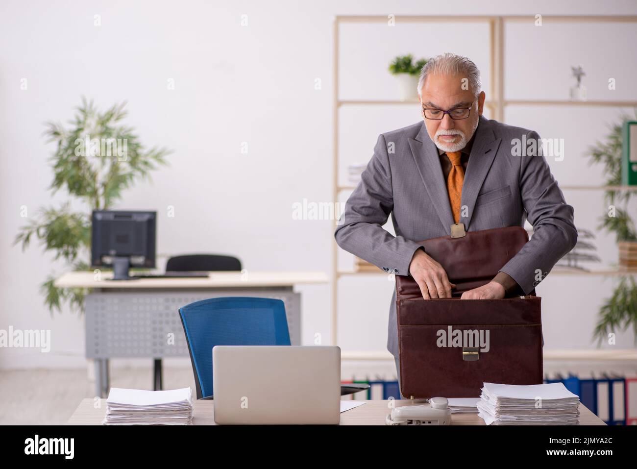 Old employee working workplace hi-res stock photography and images - Alamy