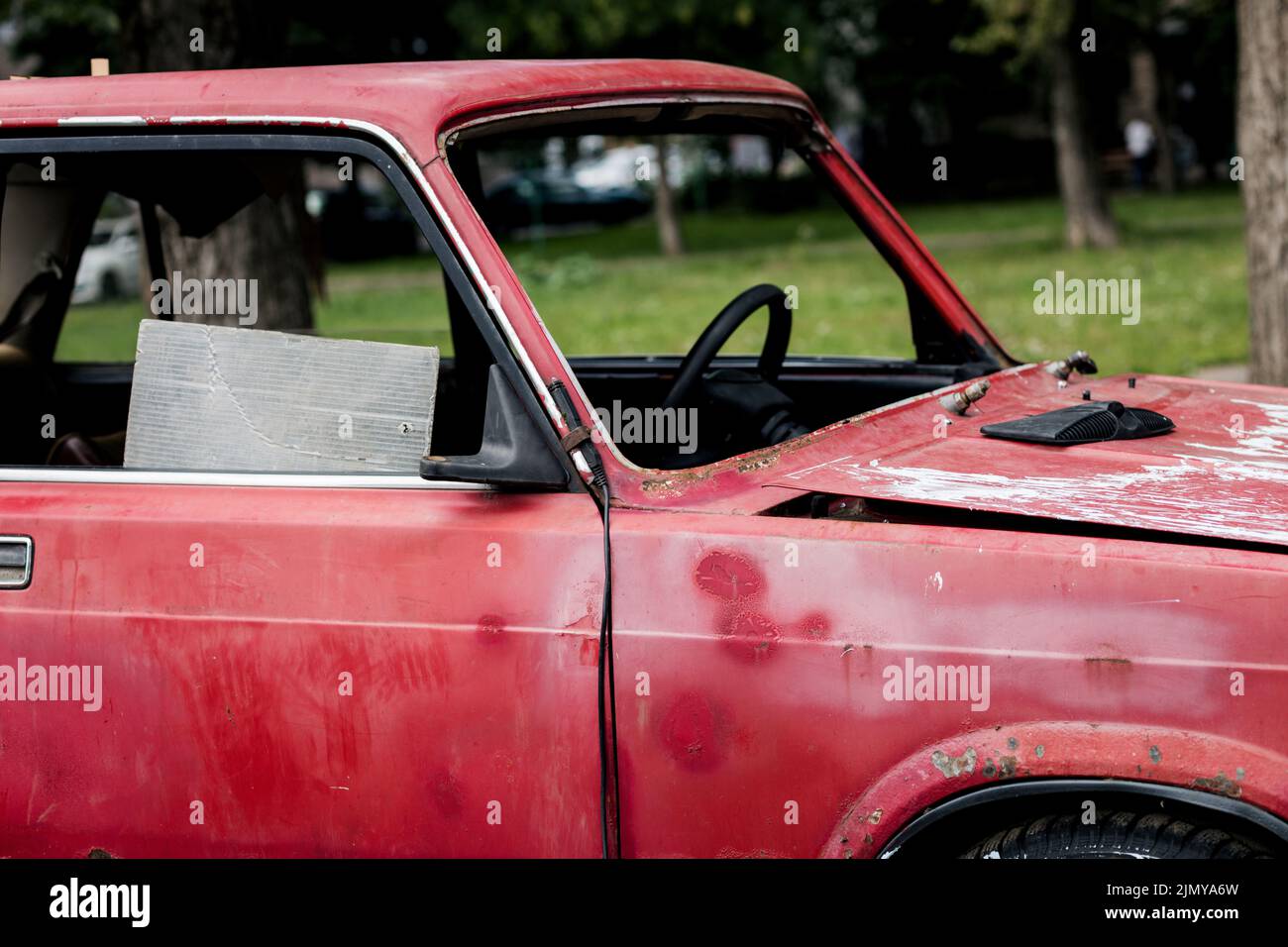 Old rusted car. red abandoned automobile Stock Photo - Alamy
