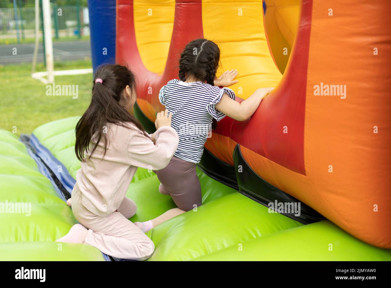 Child on obstacle course. Children's entertainment area. Inflatable ...