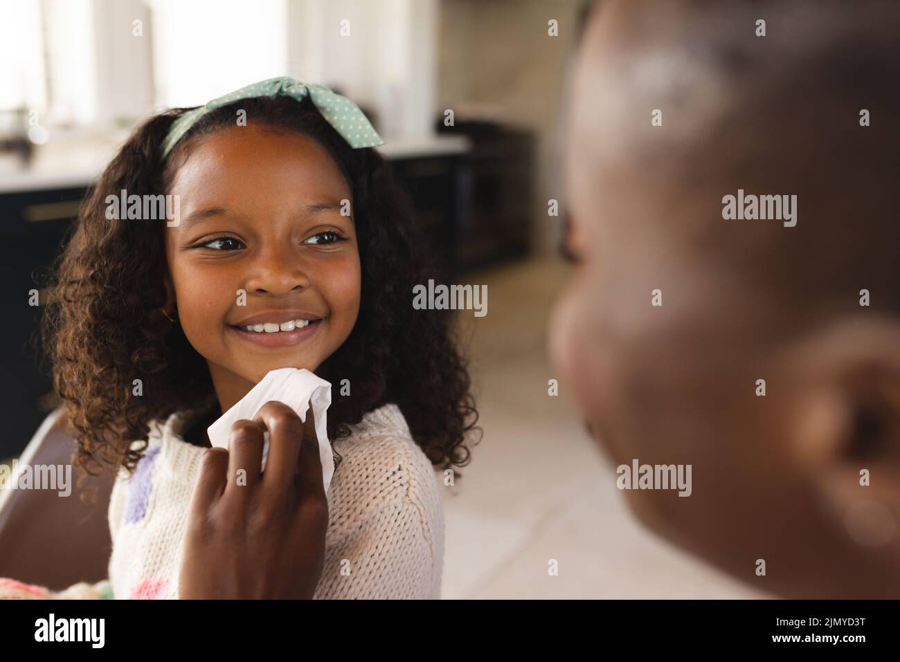 Image of happy african american girl eating breakfast with mother Stock Photo - Alamy