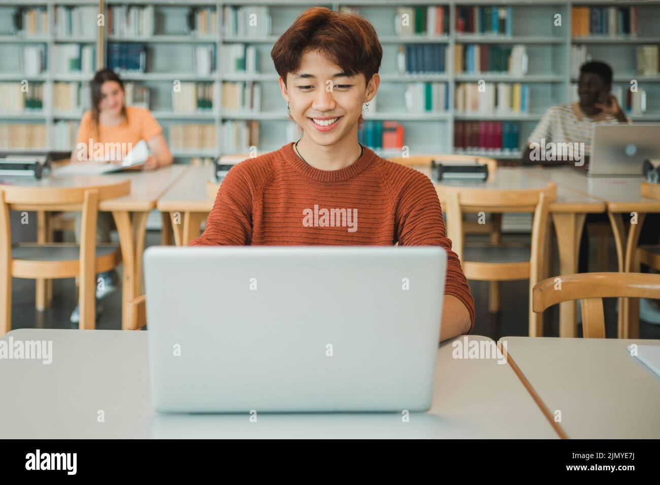 Student typing laptop teen hi-res stock photography and images - Alamy