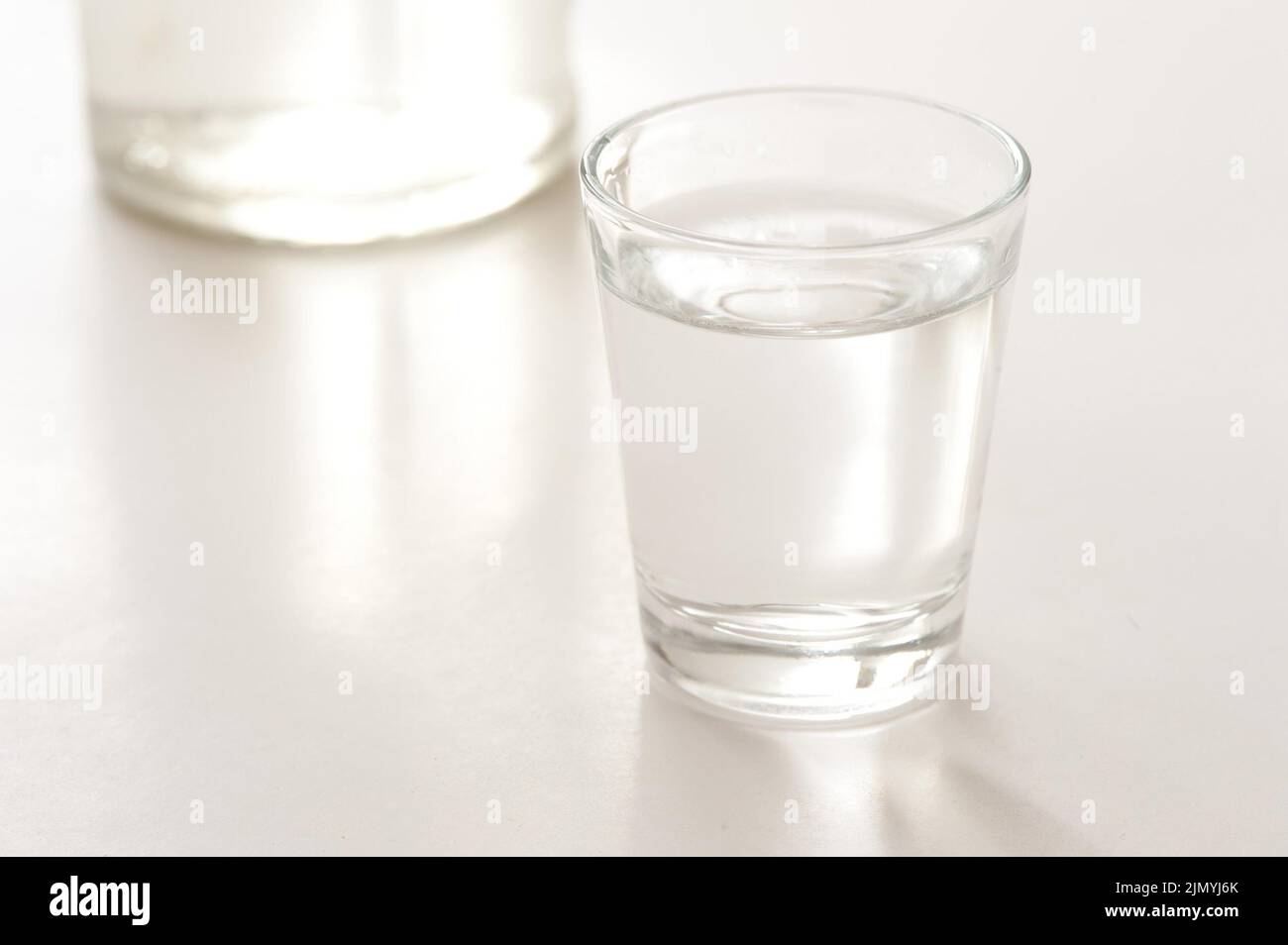 Bottle of vodka with short glass hi-res stock photography and images ...