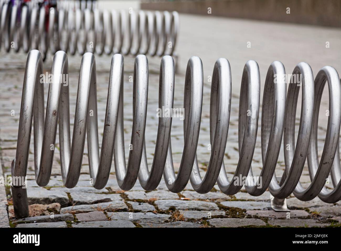 bicycle rack that looks like a large steel spring Stock Photo - Alamy