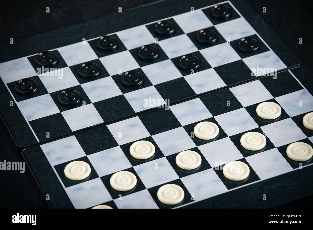 Checkers board with chips black background, checkers logical board game ...
