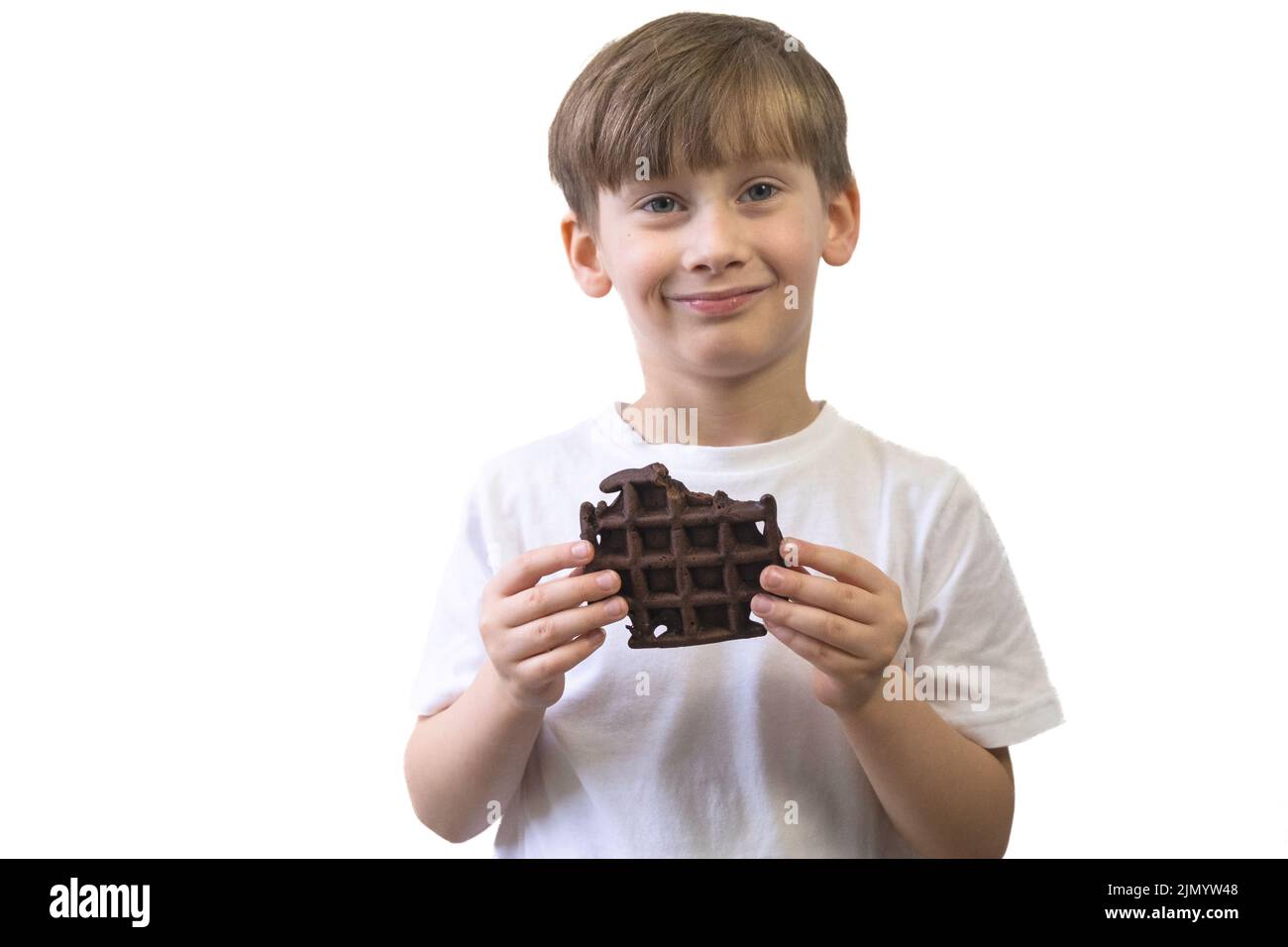 Happy boy with a chocolate waffle on a white background Stock Photo - Alamy