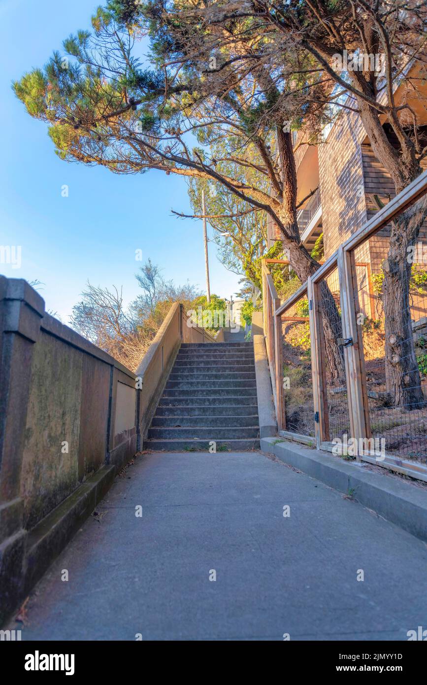Pathway leading to a stairs outside the fence of a building in San ...