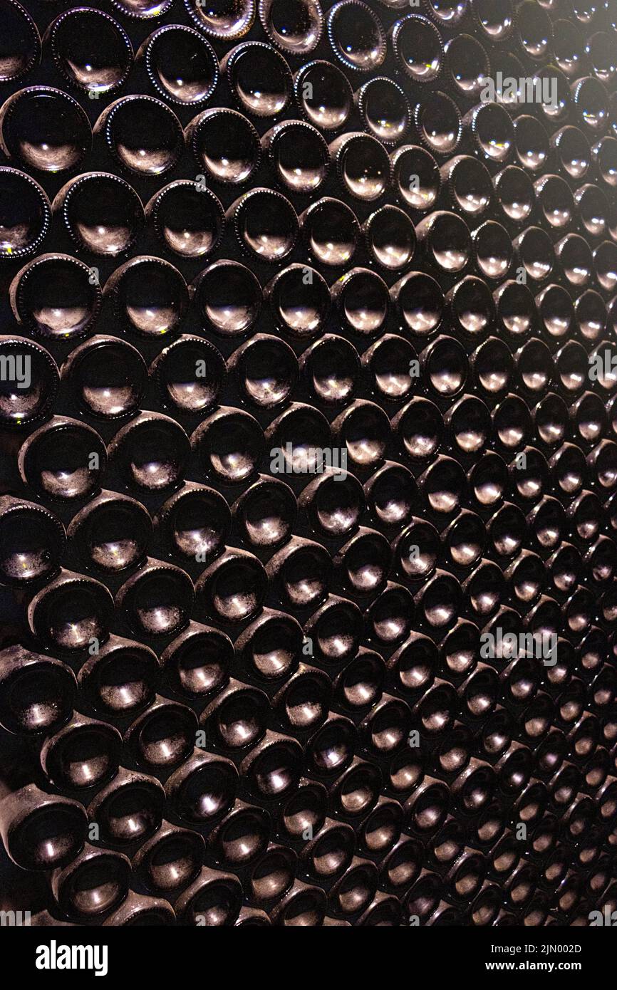 Bottles of red wine stacked in the wine cellar Stock Photo - Alamy