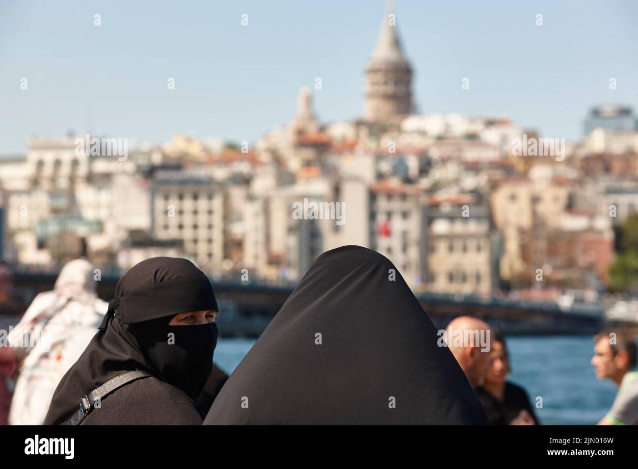 Muslim women in hijab. Galata tower in Istambul city. Turkey Stock ...